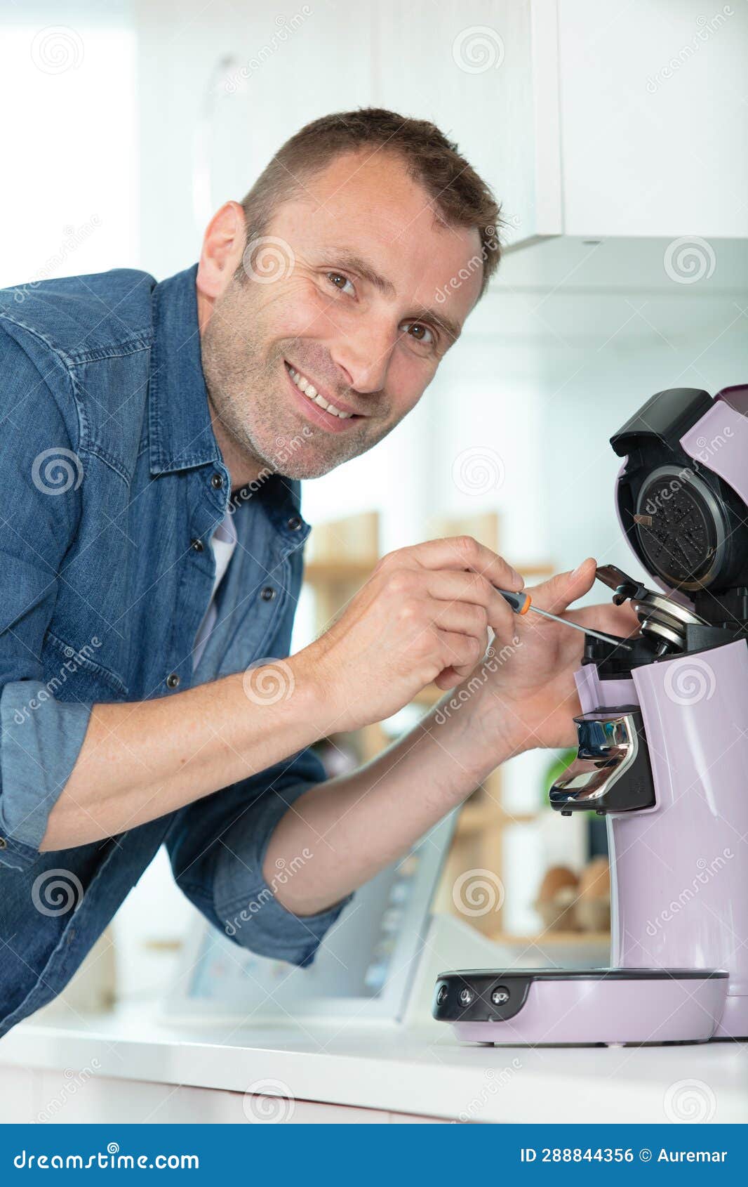 Serious Man Repairing Broken Coffee Machine Stock Photo - Image of ...