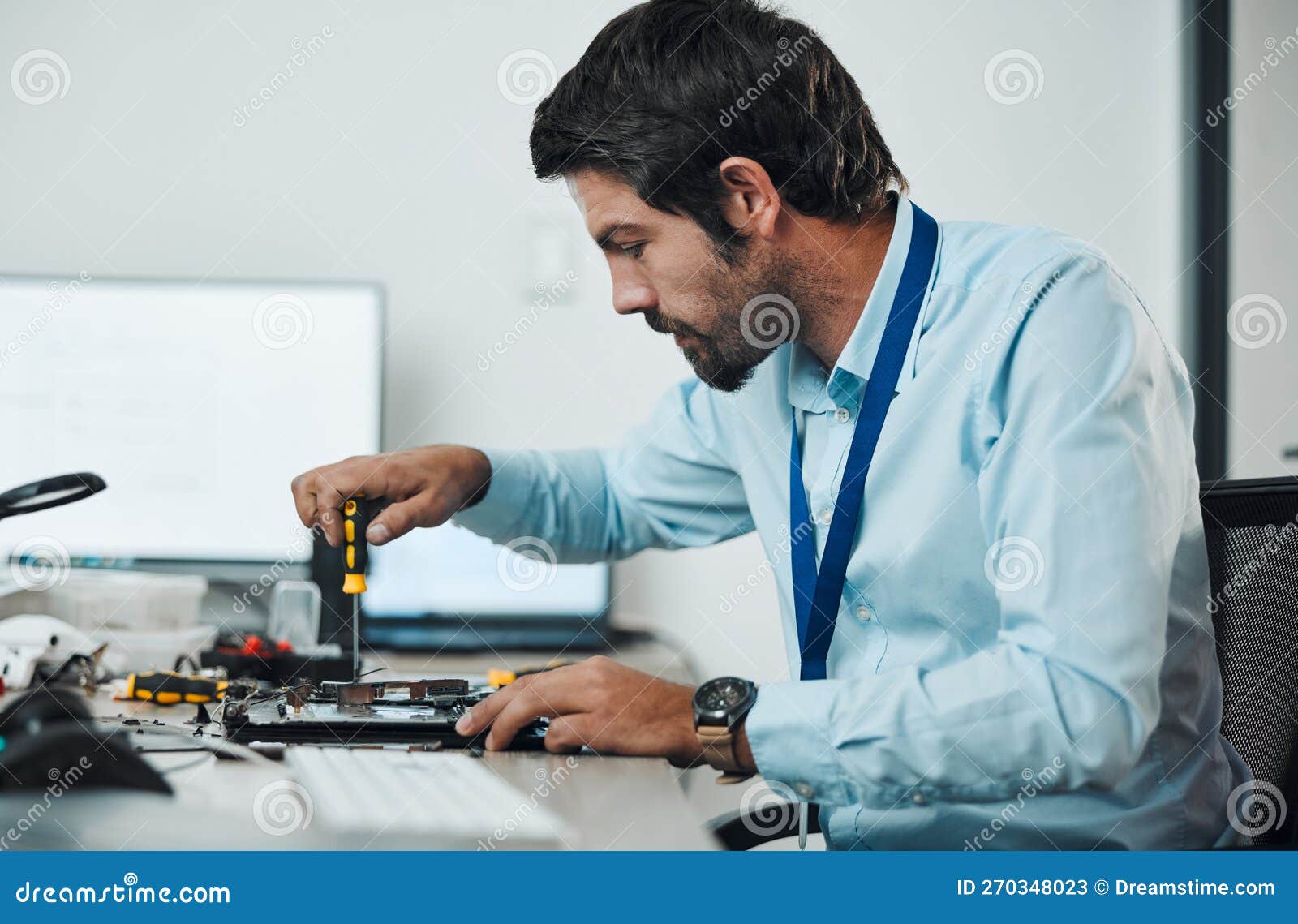Serious Man, it or Screwdriver for Motherboard Fixing in Engineering ...