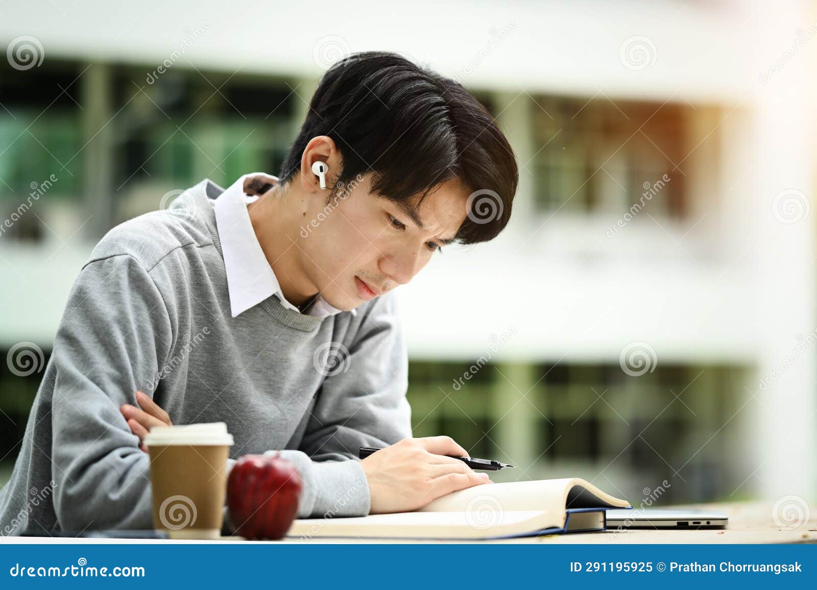 Serious Man Student Reading Textbook, Preparing for Exam or Doing ...