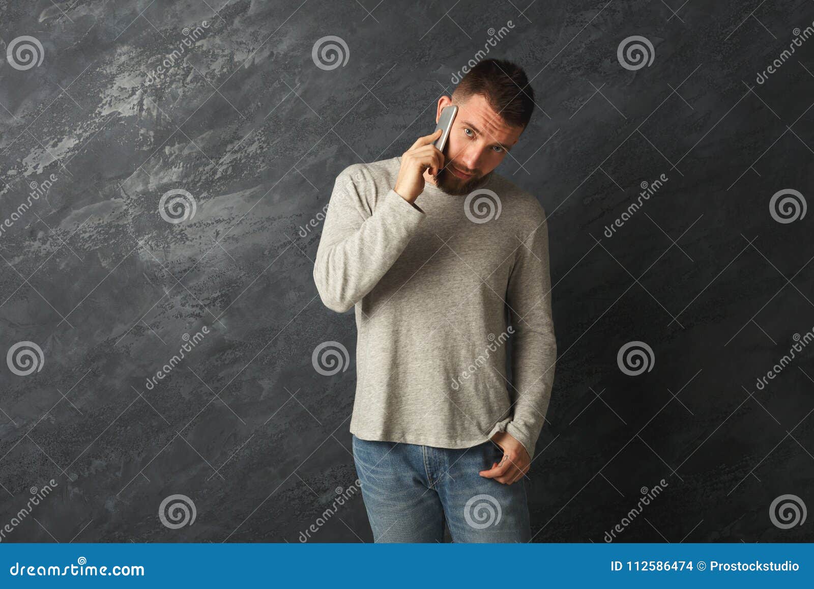 Serious Man Talking on Smartphone in Studio Stock Photo - Image of ...