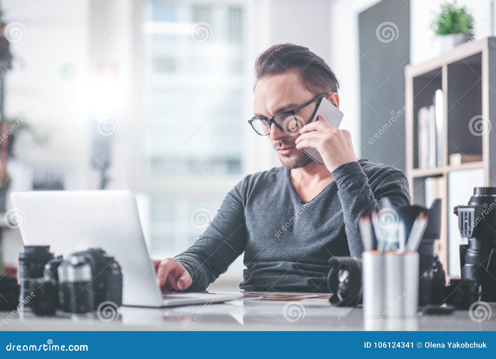 Serious Man Telling by Phone in Office Stock Image - Image of desk ...
