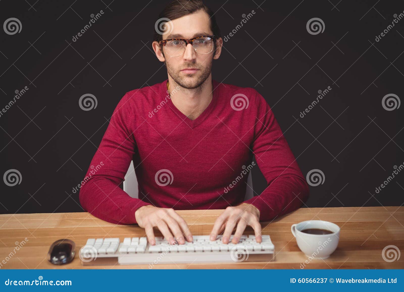 Serious Man Typing on Keyboard with Coffee on Desk Stock Image - Image ...