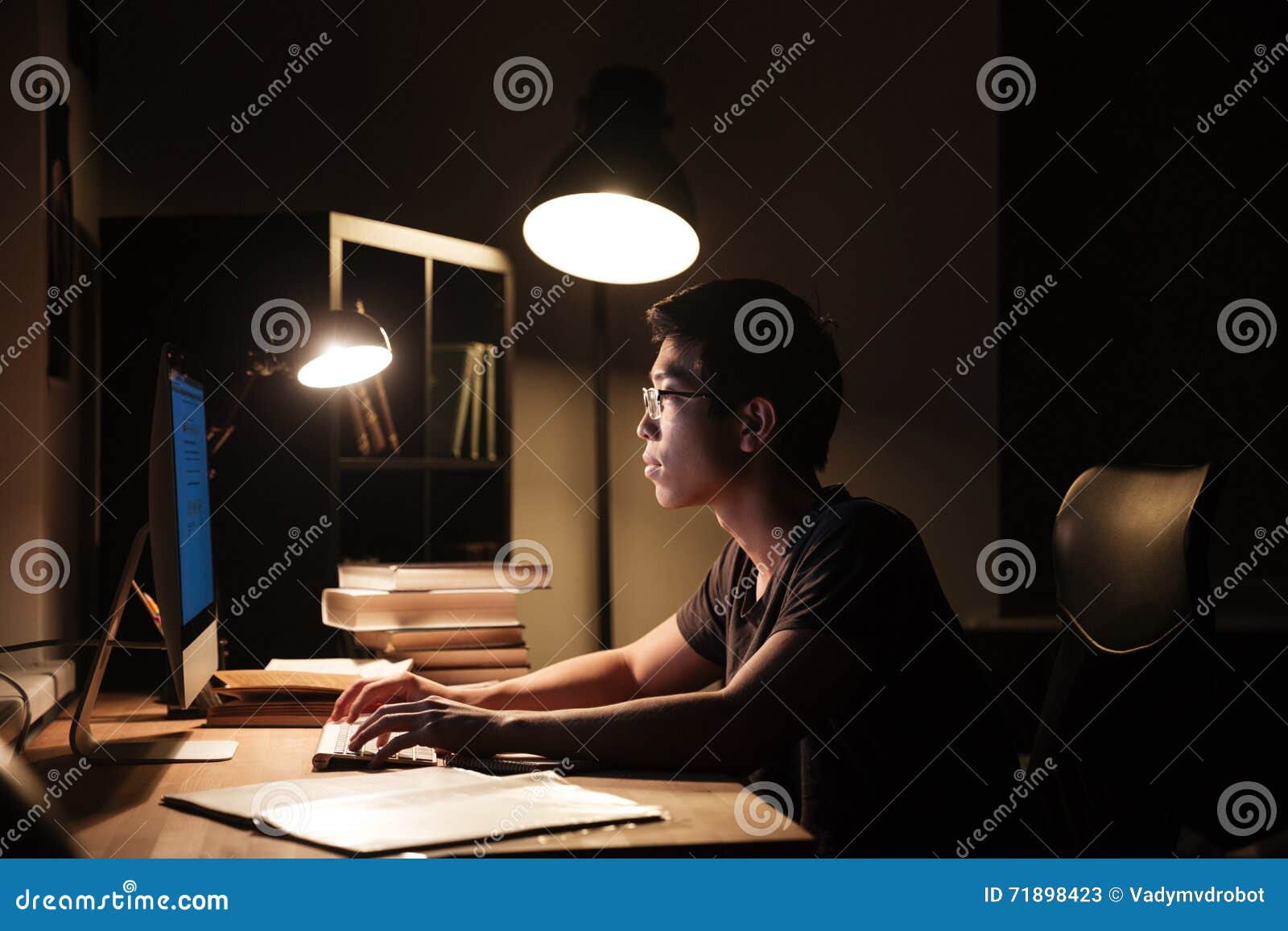 Serious Man Using Computer and Typing in Dark Room Stock Image - Image ...