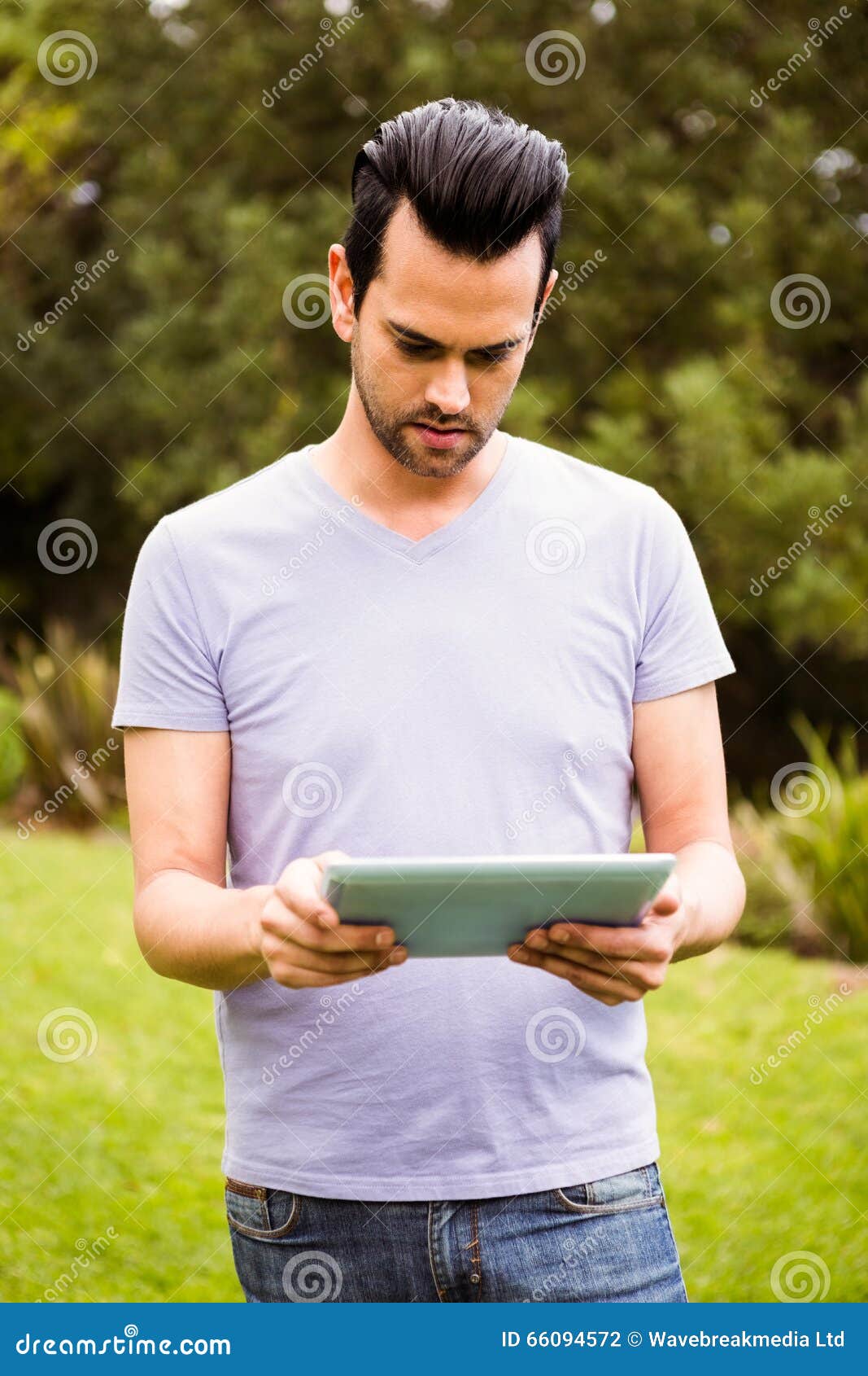 Serious man using tablet stock photo. Image of domestic - 66094572
