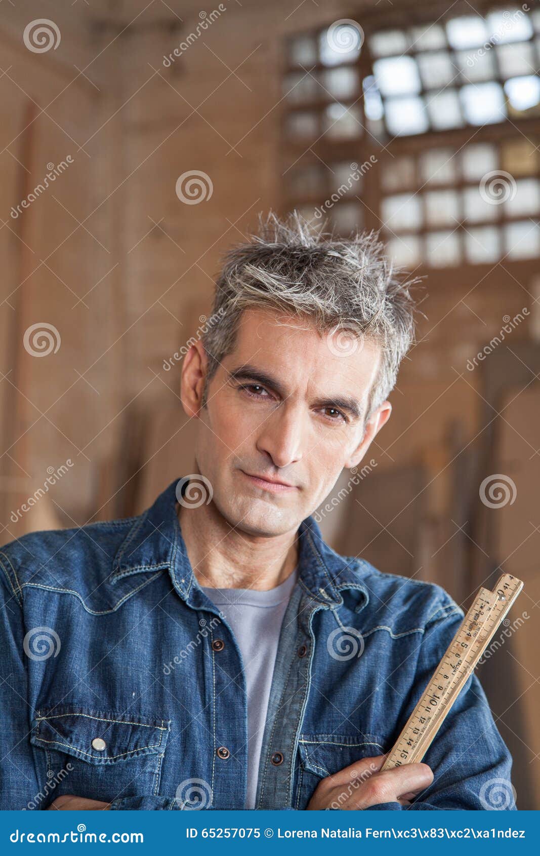 Serious Man Wholding a Ruler Stock Image - Image of years, worker: 65257075