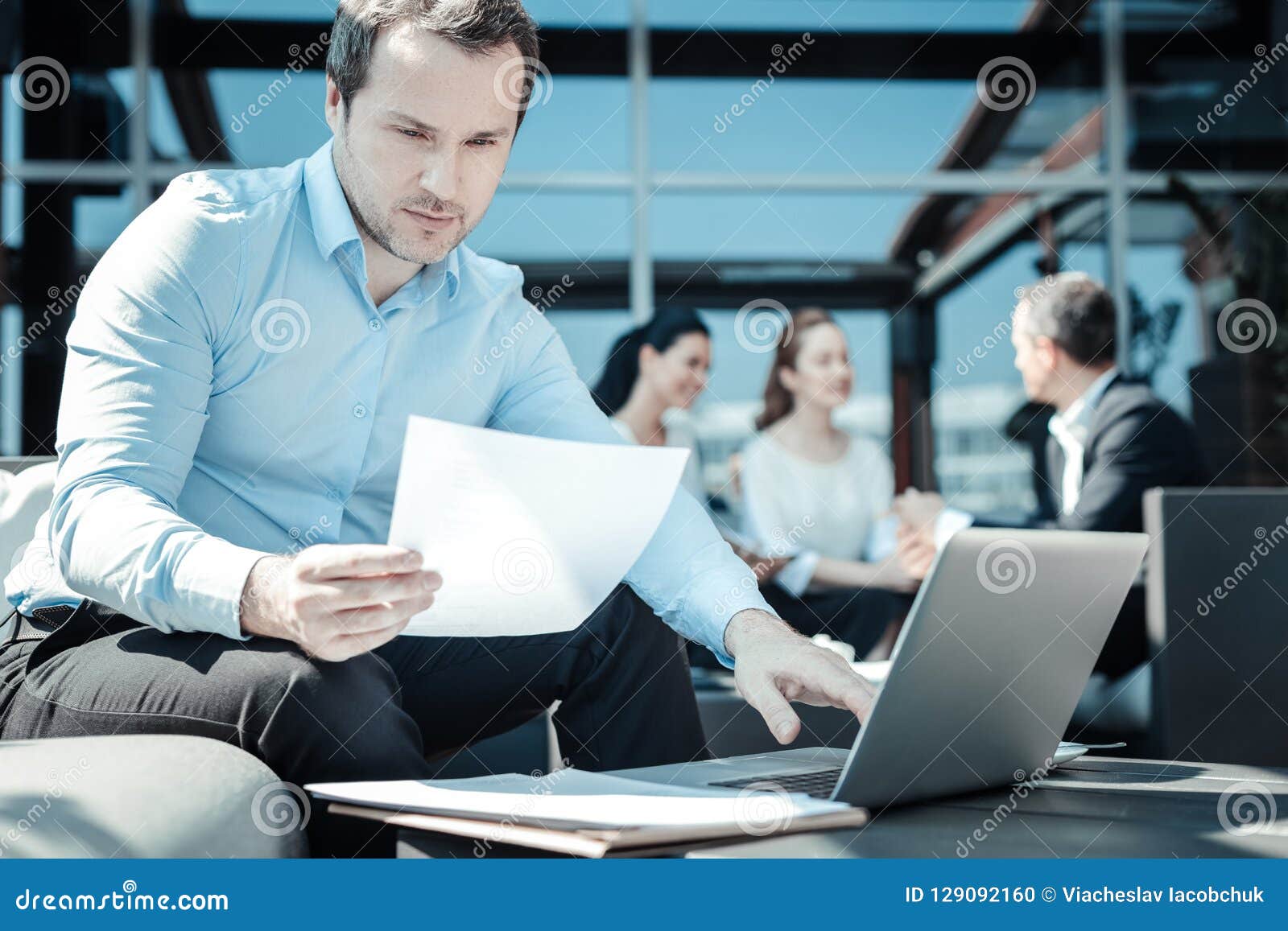 Serious Man Working during Break Stock Photo - Image of colleagues ...