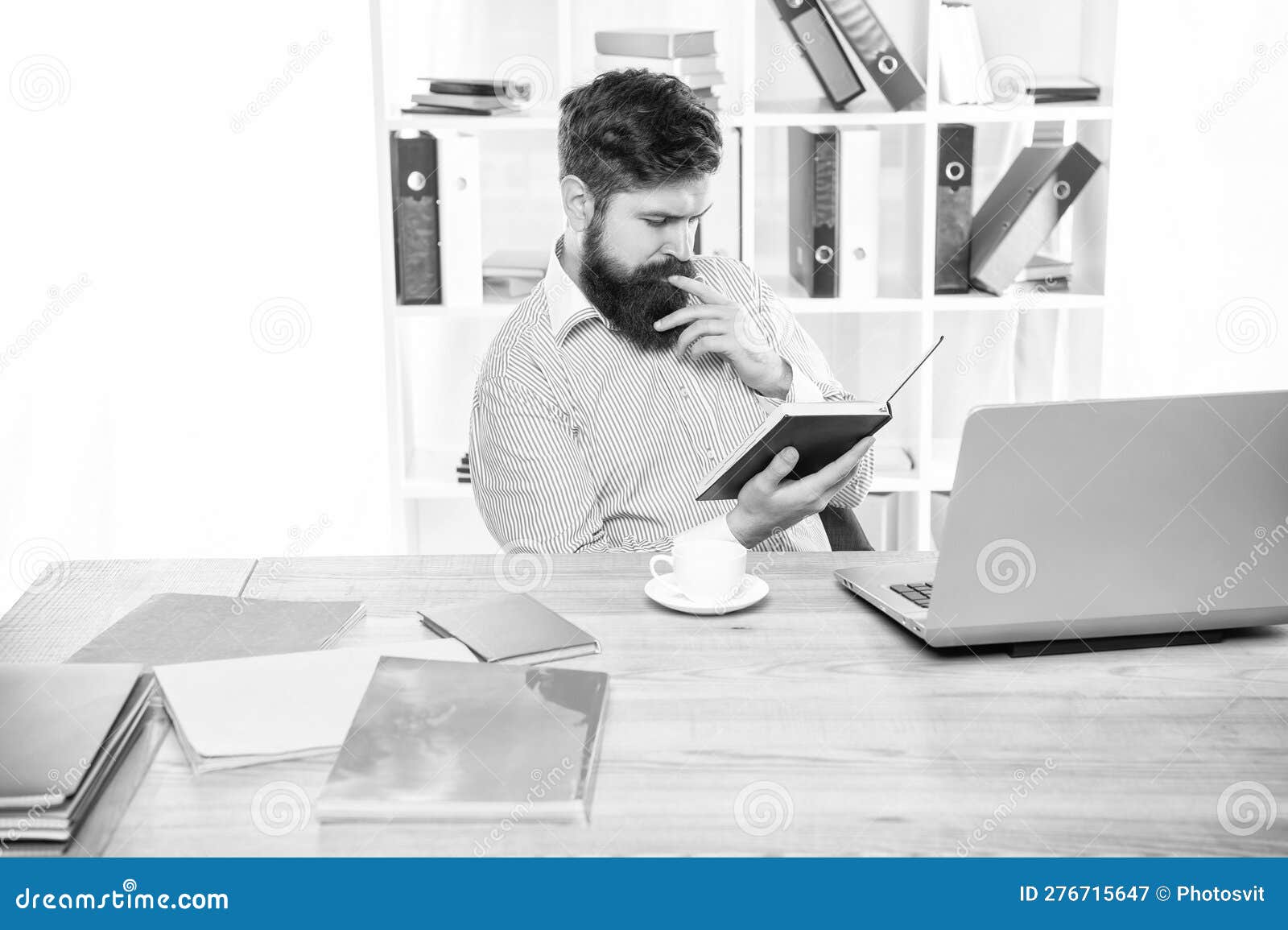 Serious Manager Reading Book Sitting at Office Desk Stock Image - Image ...