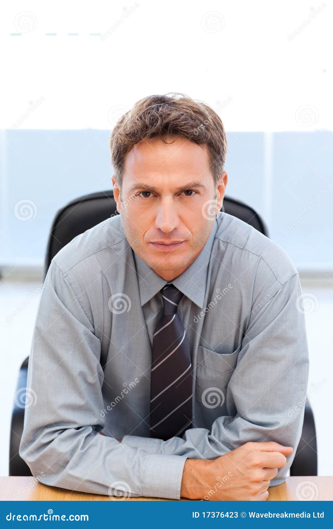 Serious Manager Sitting at a Table Stock Image - Image of director ...