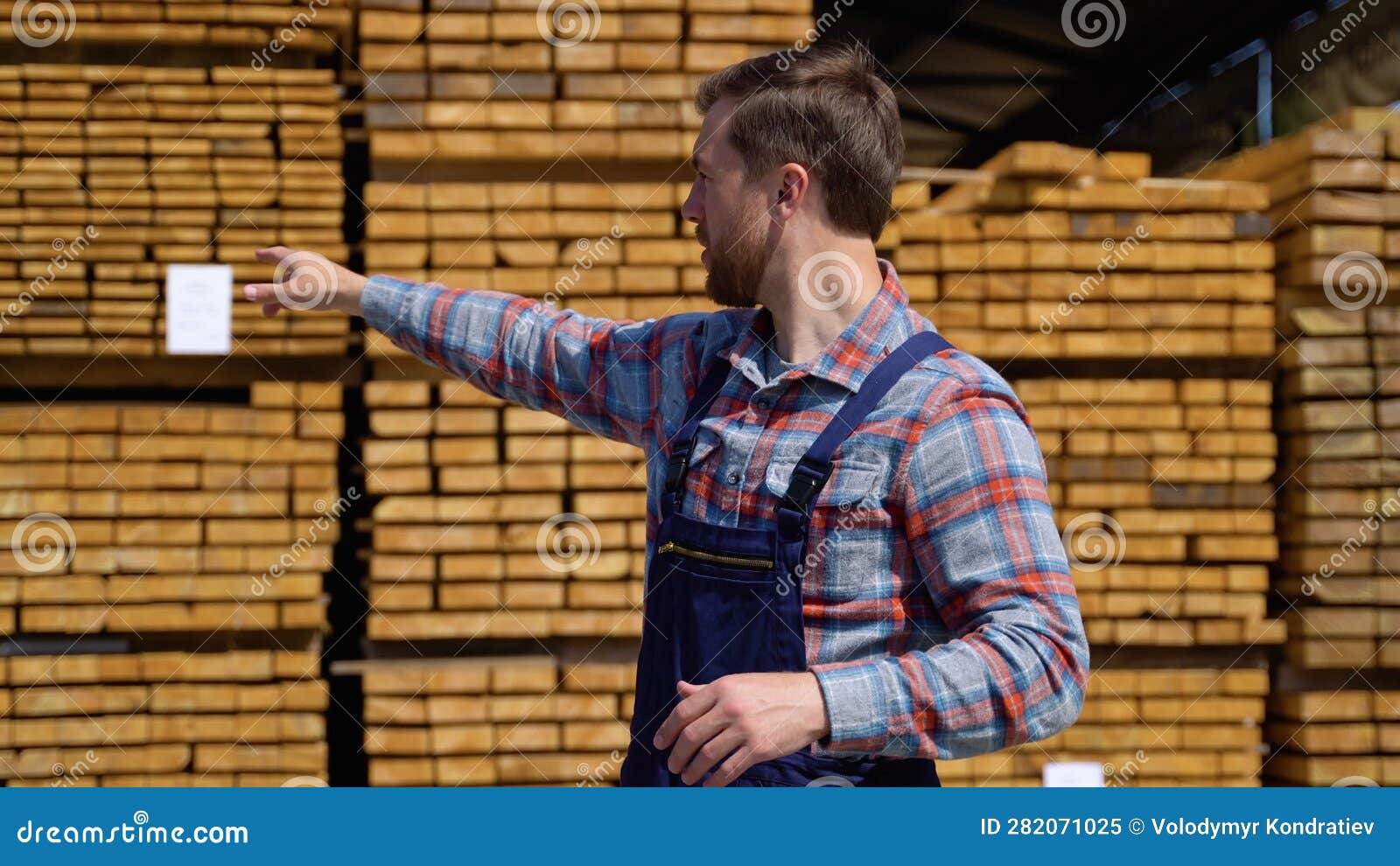 Serious Manager in Uniform Giving Commands To Workers on Timber ...