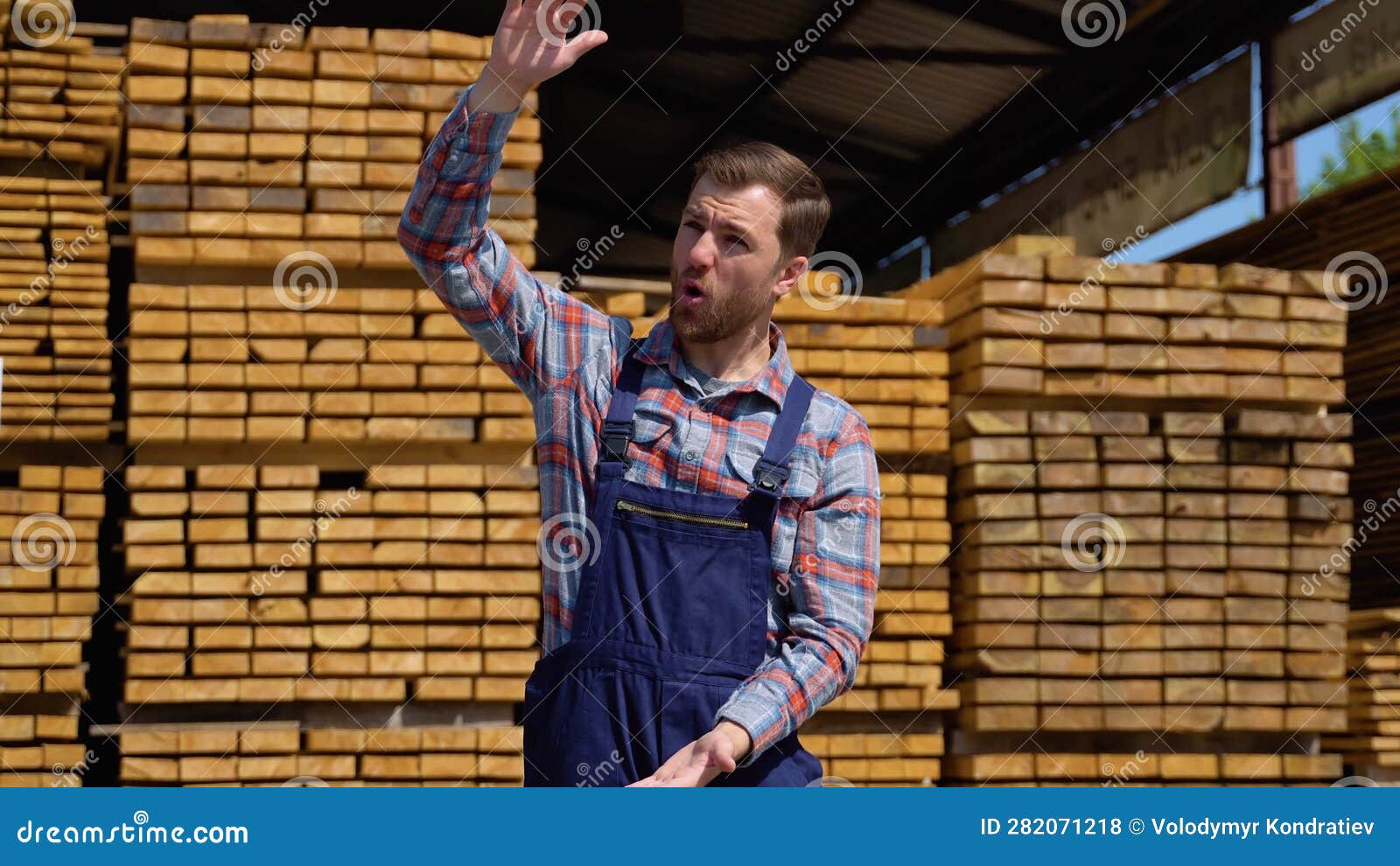 Serious Manager in Uniform Giving Commands To Workers on Lumber ...