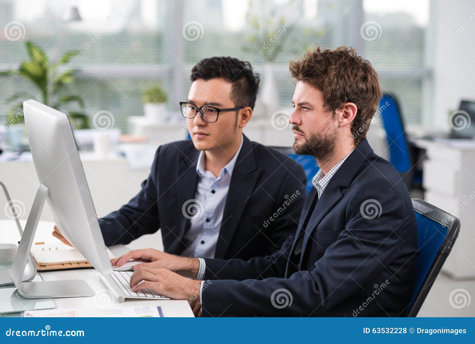 Serious managers stock photo. Image of technology, together - 63532228