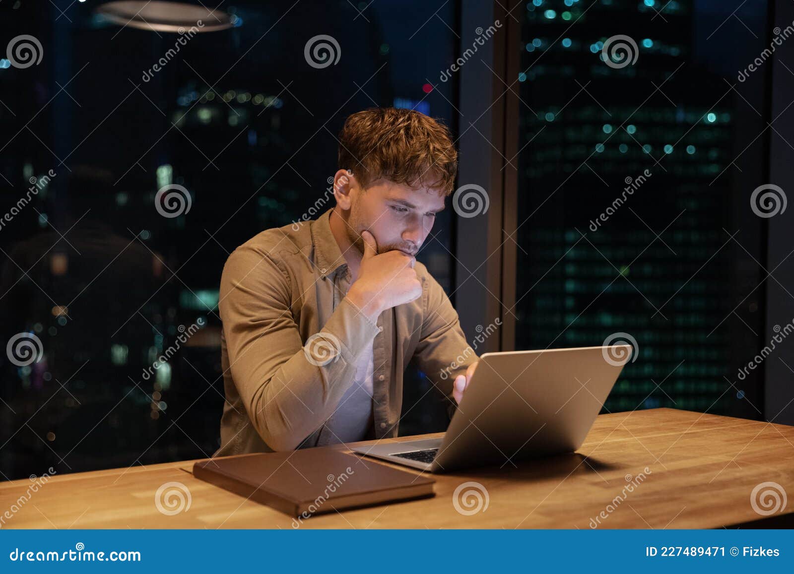 Young Employee Working on Laptop until Late in Office Stock Image ...