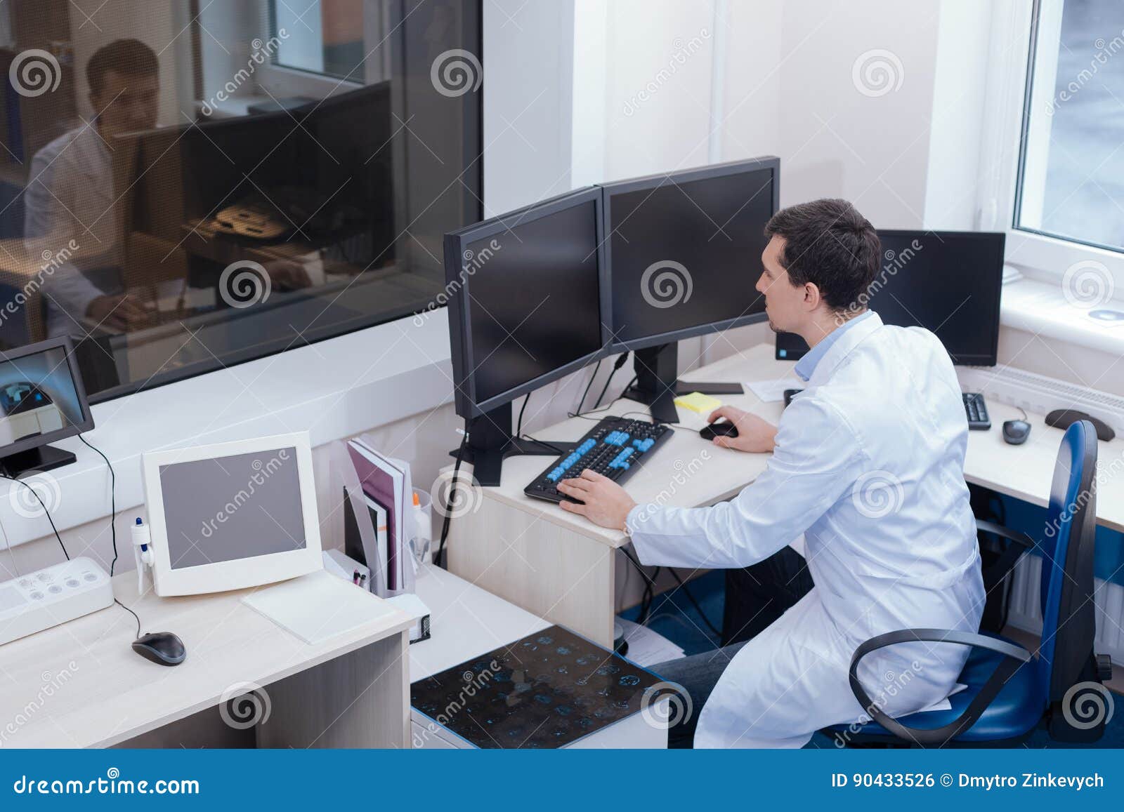 Serious Nice Doctor Working on the Computer Stock Photo - Image of ...