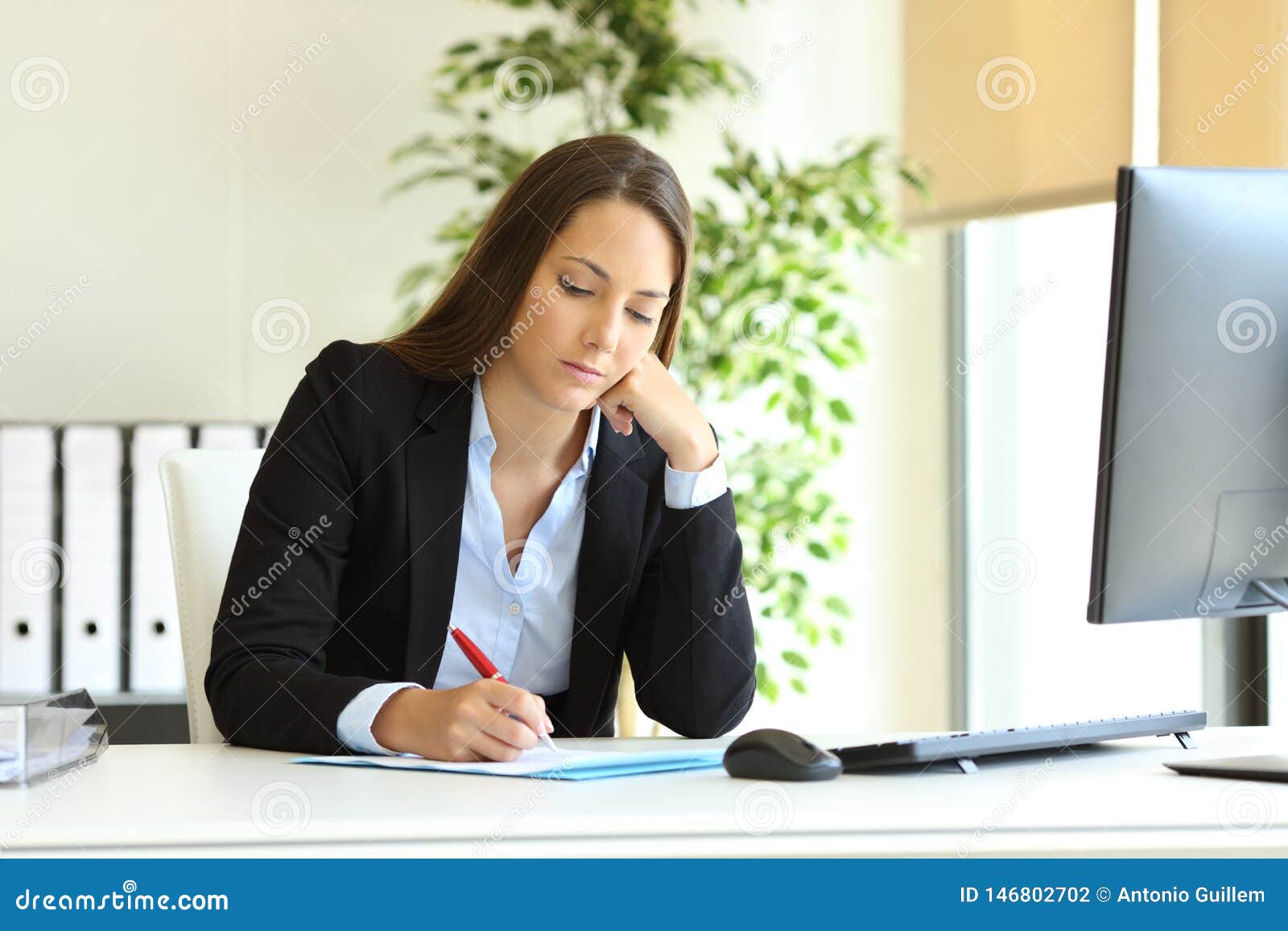 Serious Office Worker Writing On Document Stock Photo | CartoonDealer ...