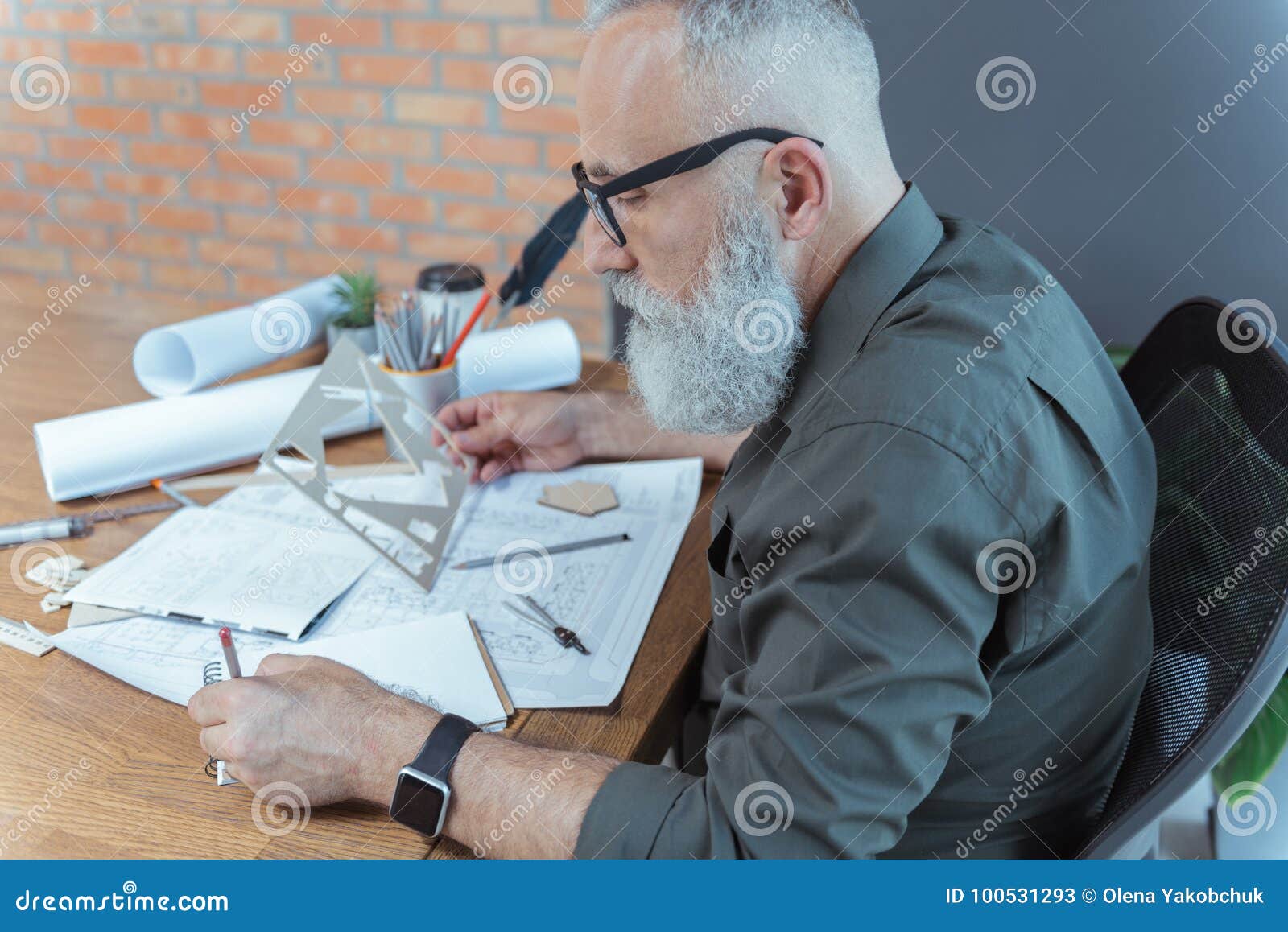 Serious Old Engineer is Correcting Building Plan Stock Image - Image of ...