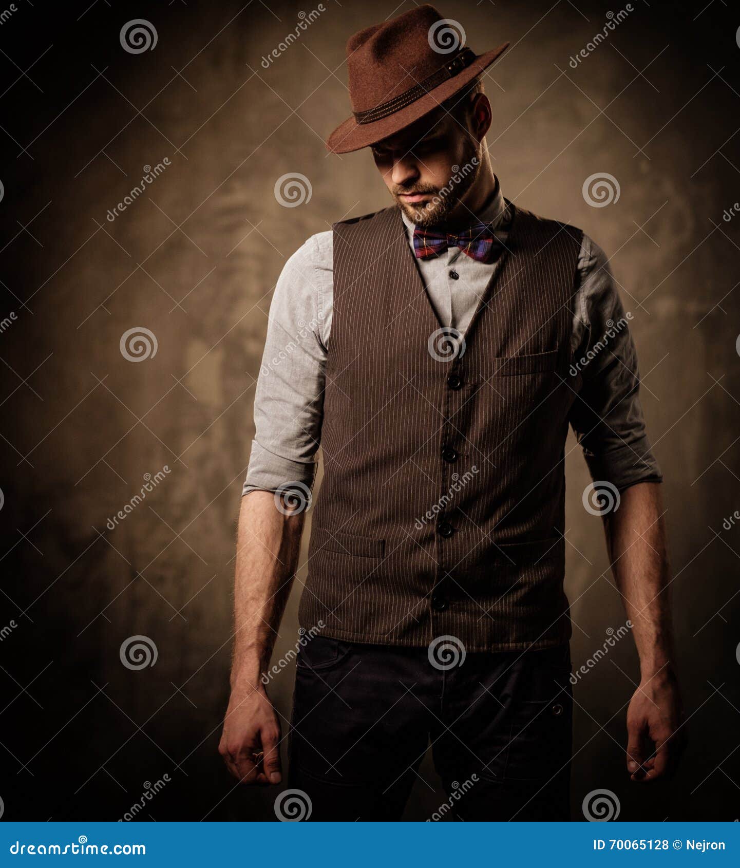 Serious Old-fashioned Man with Hat Posing on Dark Background. Stock ...