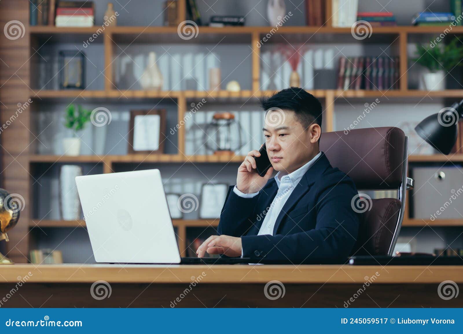Serious and Pensive Asian Businessman, Boss, Working in a Classic ...