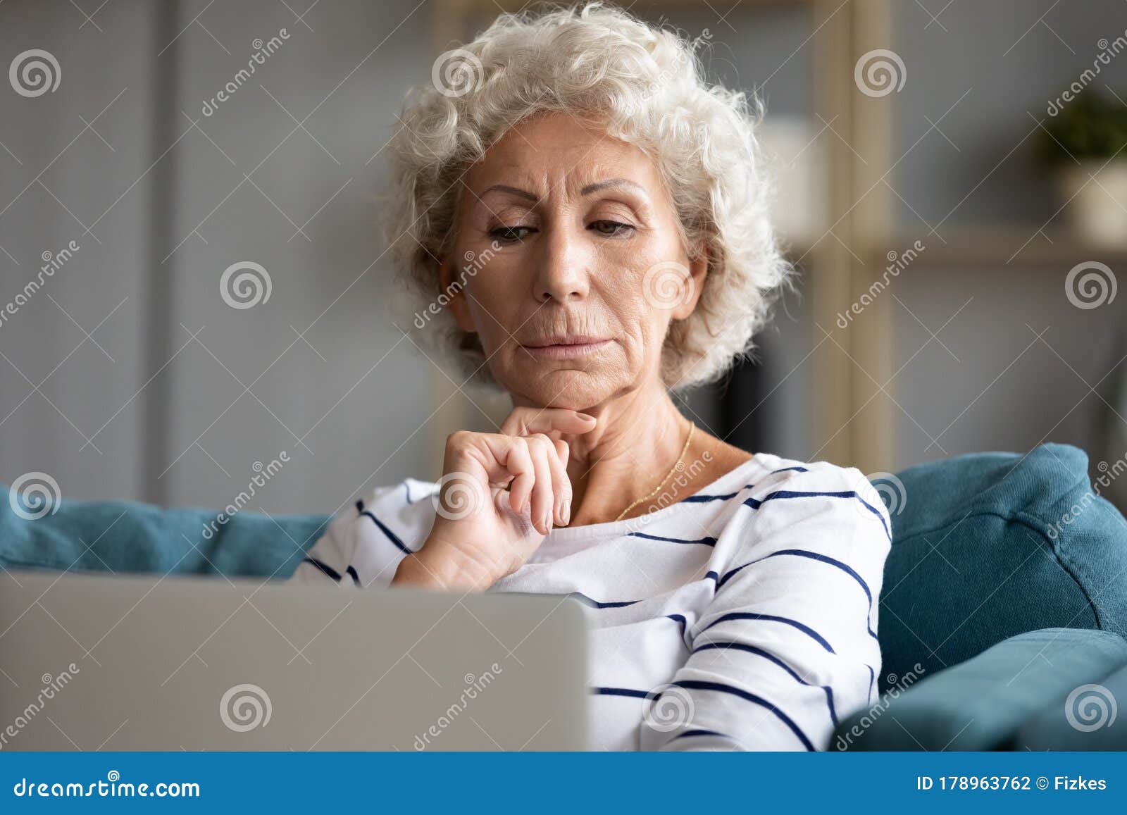 Serious Pensive Older Woman Looking at Laptop Screen Stock Photo ... Serious Pensive Older Woman Looking at Laptop Screen Stock Photo ...