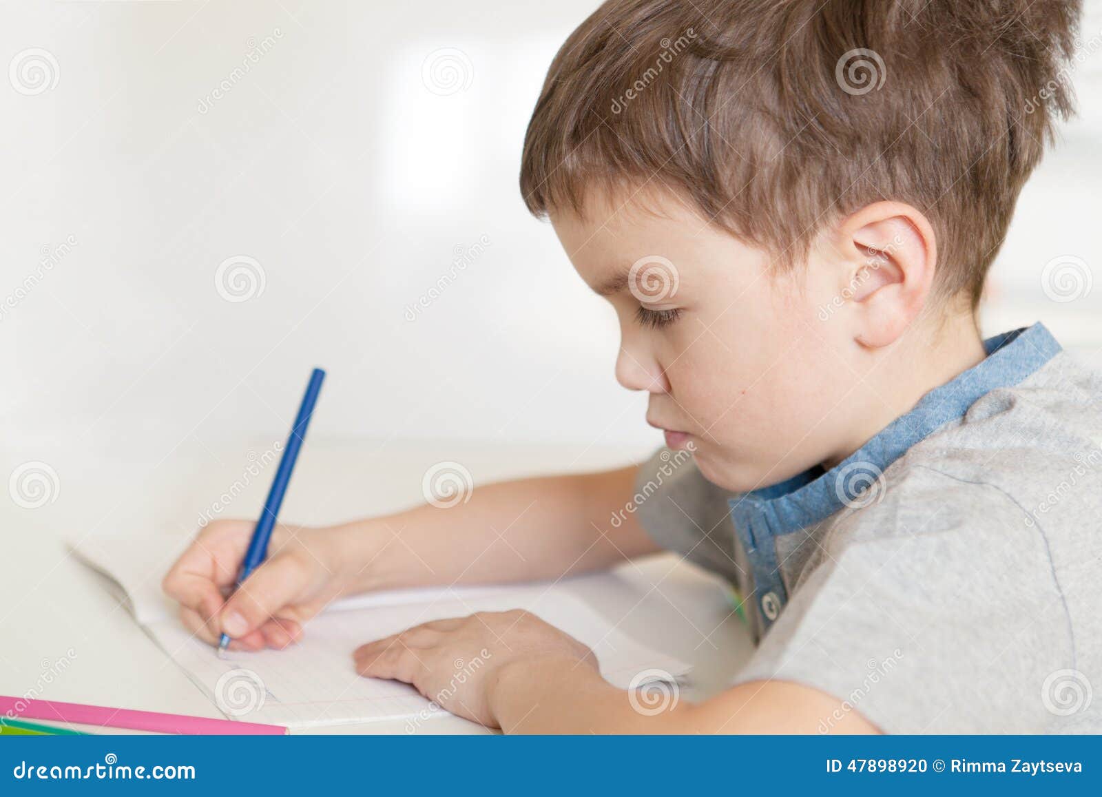 Serious Pensive Pupil Sits at Desk Stock Photo - Image of textbooks ...