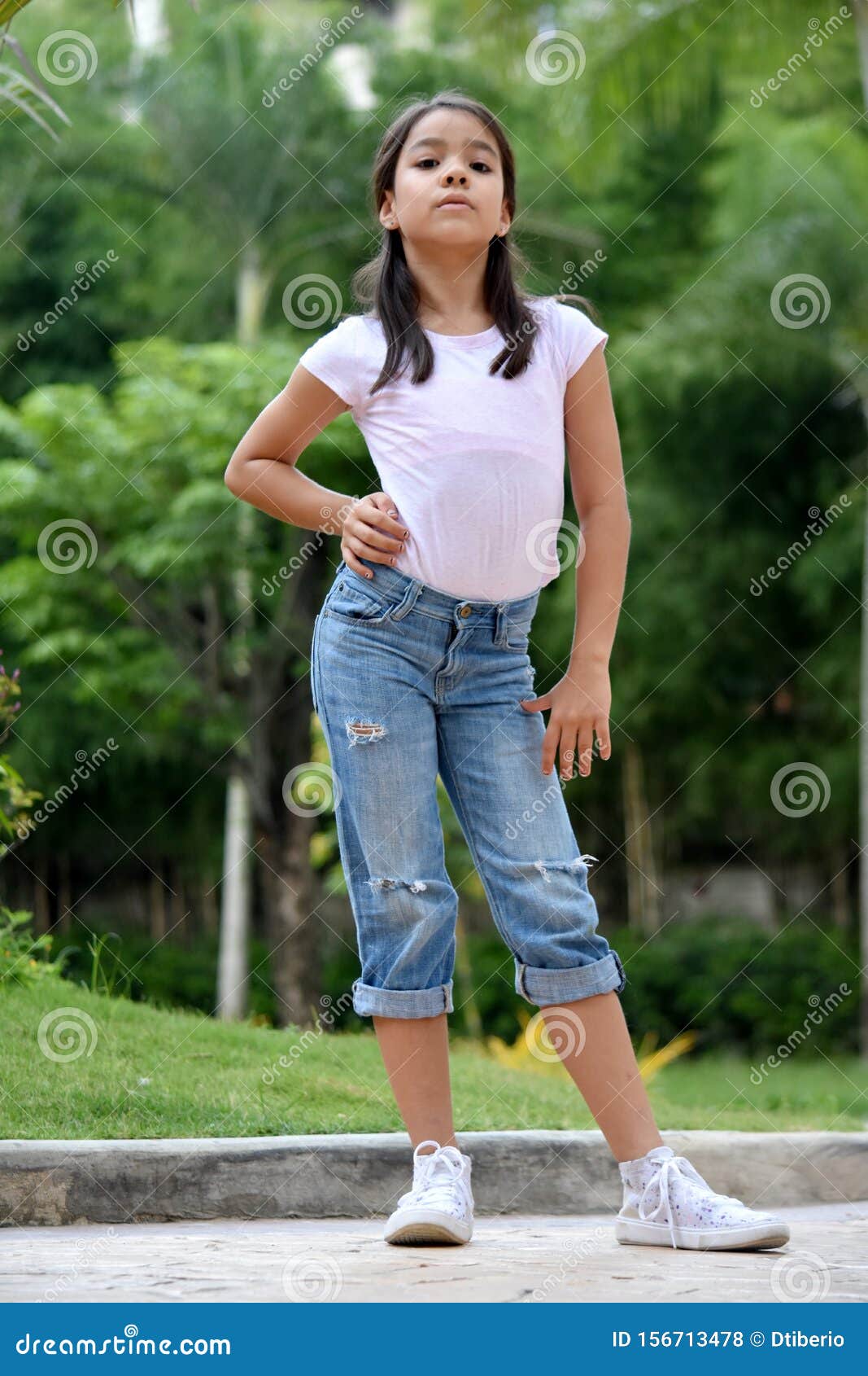 A Serious Petite Minority Person Standing Stock Photo - Image of ...
