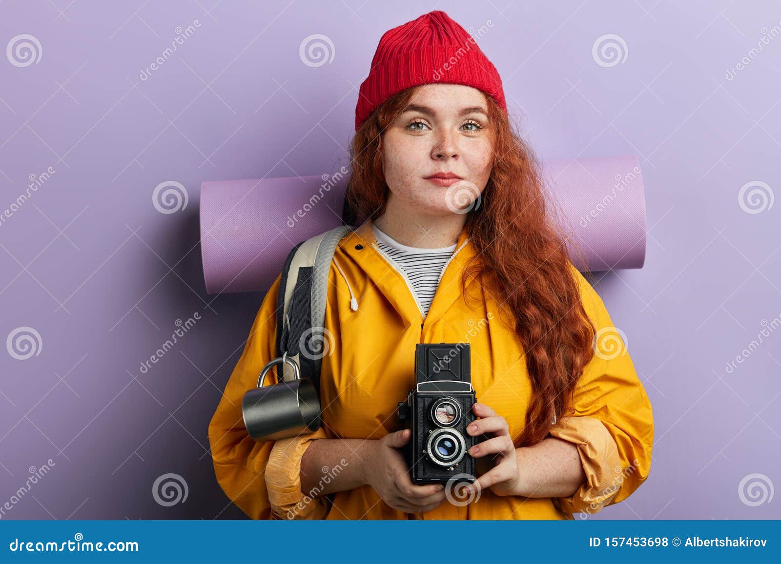 Serious Pleasant Female Backpacker Using Her Camera Stock Photo - Image ...