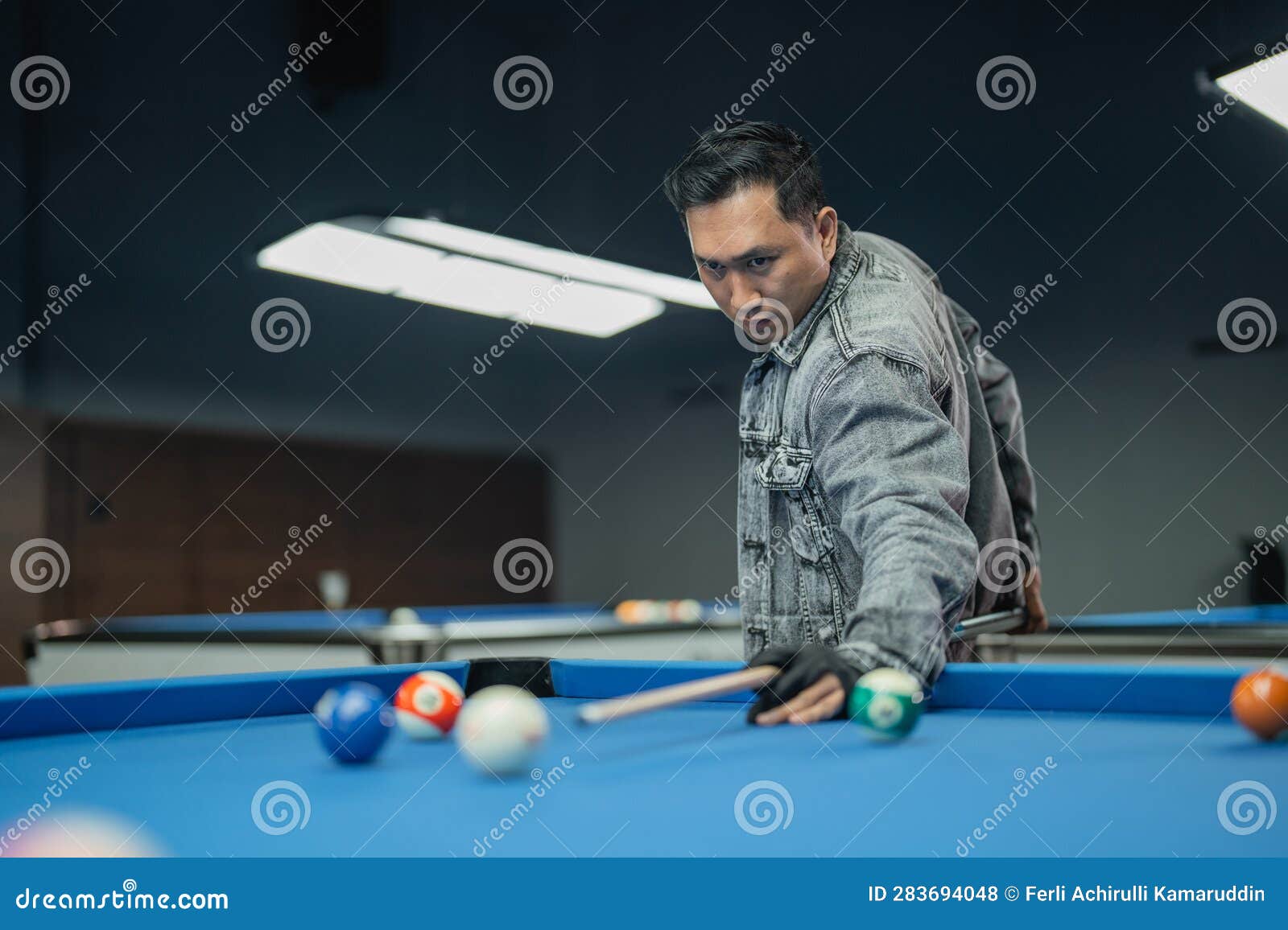 Serious Pool Player Poking the White Ball Stock Photo - Image of ...