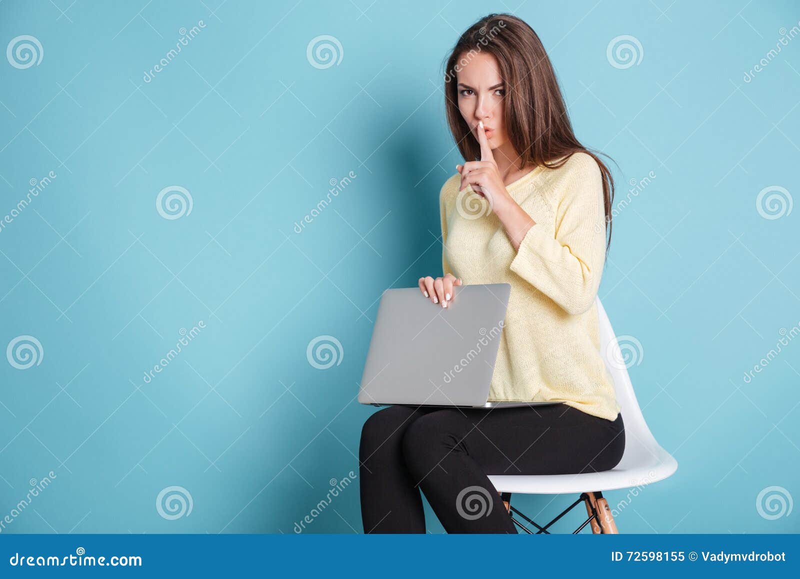 Serious Pretty Woman Making Silence Gesture Using Laptop Stock Image ...