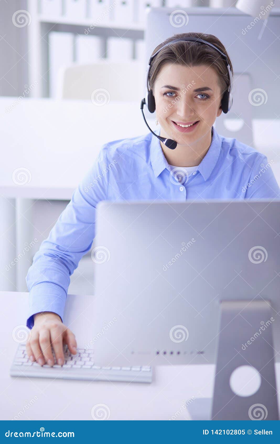 Serious Pretty Young Woman Working As Support Phone Operator with ...