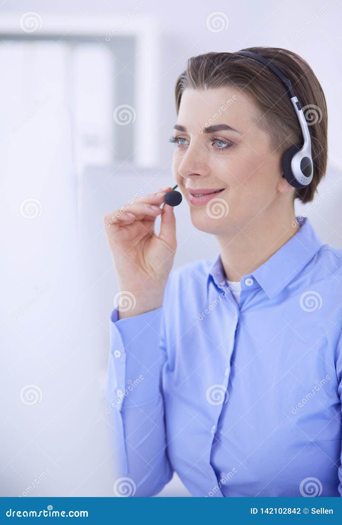 Serious Pretty Young Woman Working As Support Phone Operator with ...