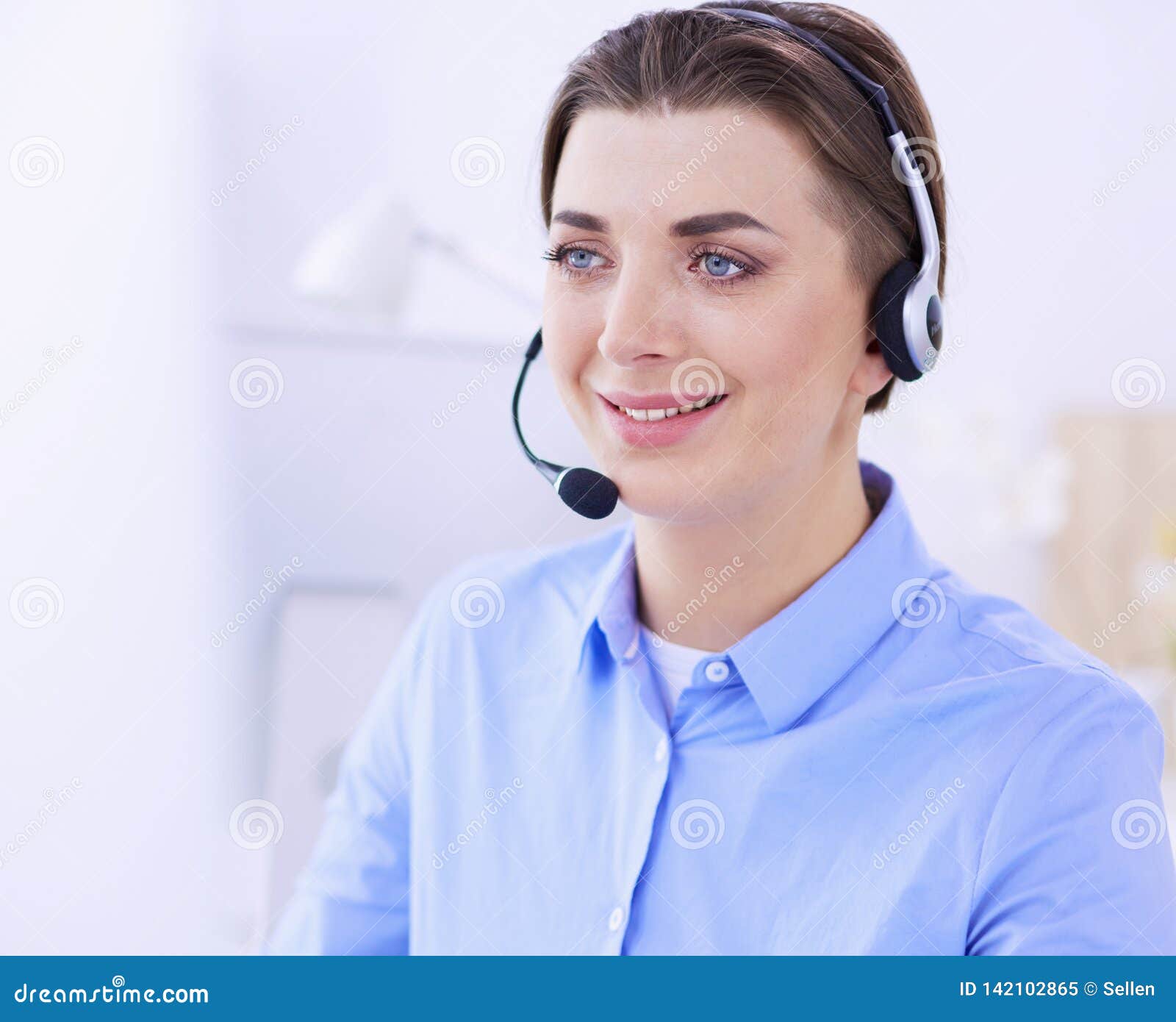 Serious Pretty Young Woman Working As Support Phone Operator with ...