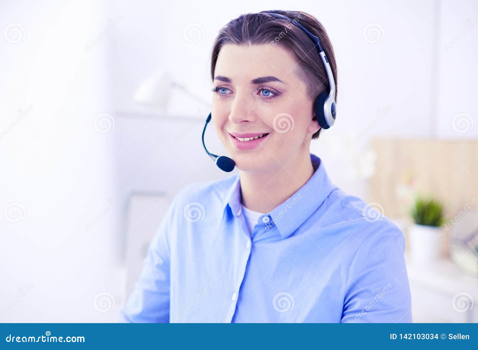 Serious Pretty Young Woman Working As Support Phone Operator with ...