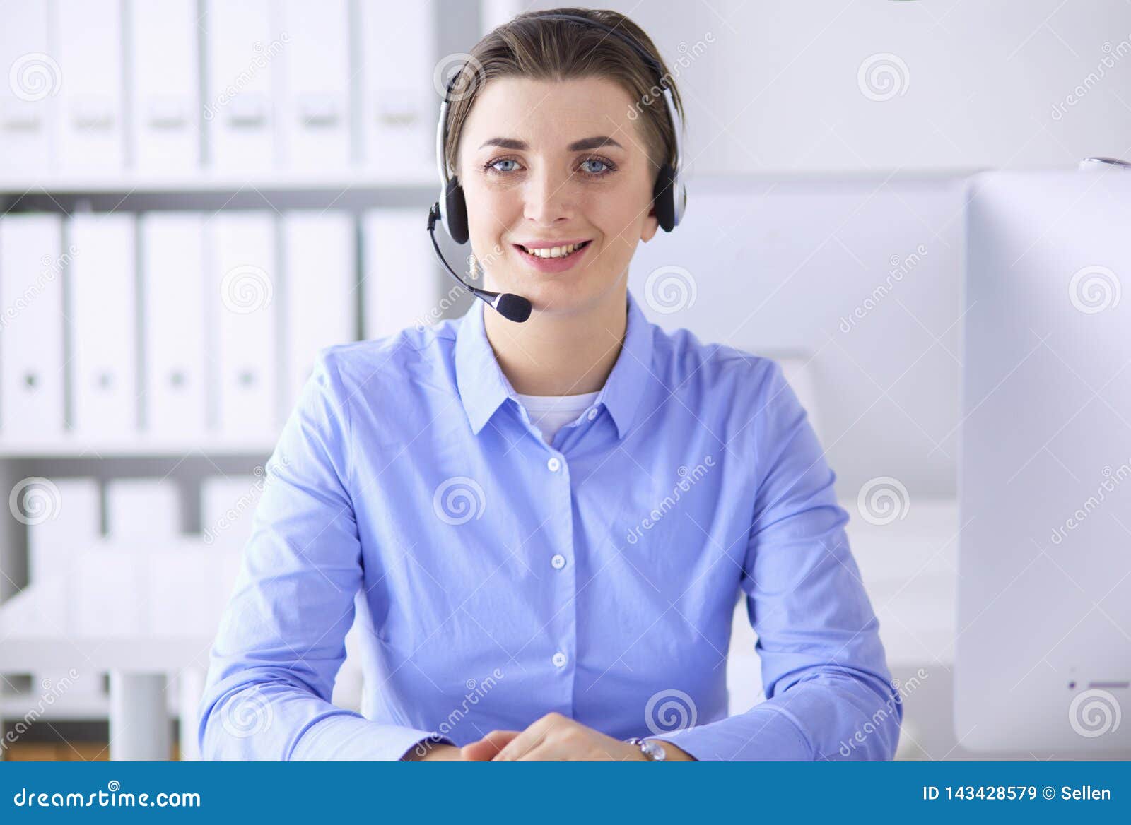 Serious Pretty Young Woman Working As Support Phone Operator with ...