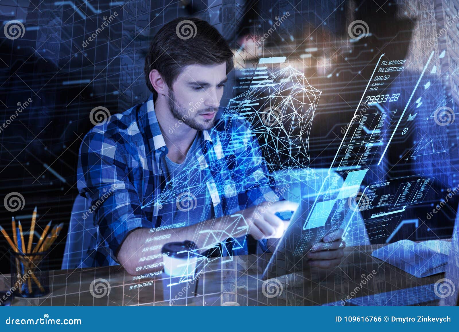 Smart Programmer Looking at His Tablet while Sitting in His Office ...