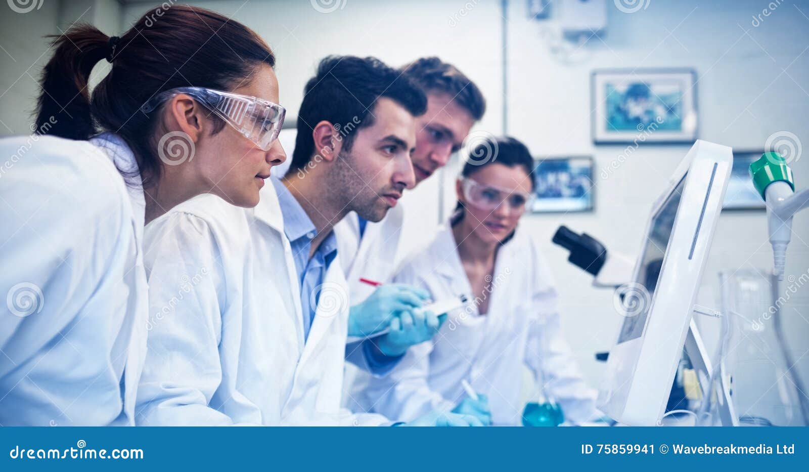 Serious Researchers Looking at Computer Screen in the Lab Stock Image ...