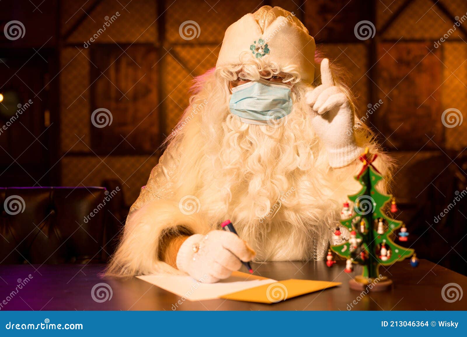 Thoughtful Santa Claus in Protective Mask Taking Notes on Paper Stock ...