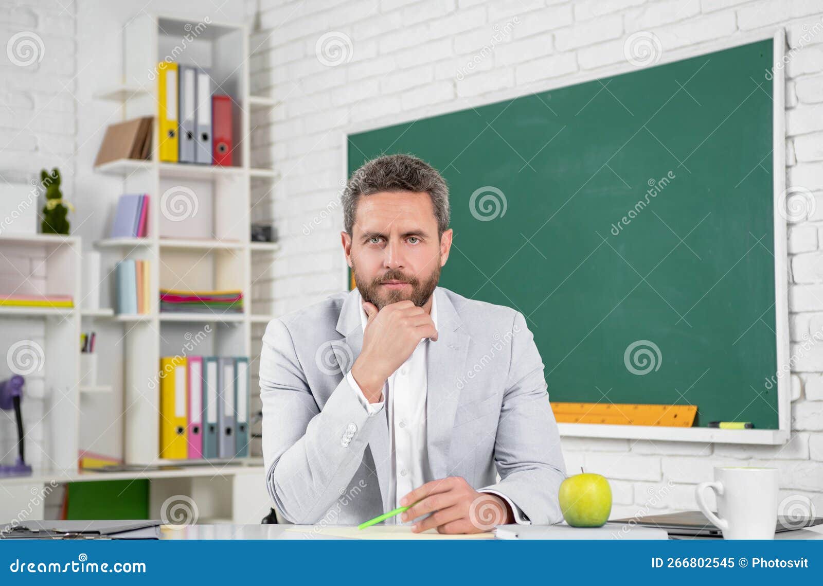 Serious School Teacher in Classroom at Blackboard Stock Image - Image ...