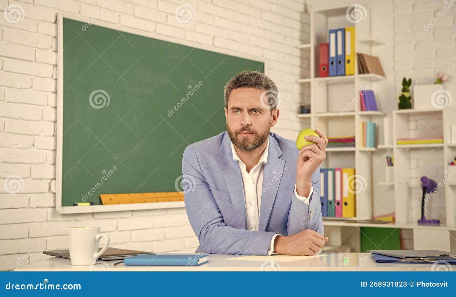 Serious School Tutor in Classroom at Blackboard Stock Image - Image of knowledge, teacher: 268931823