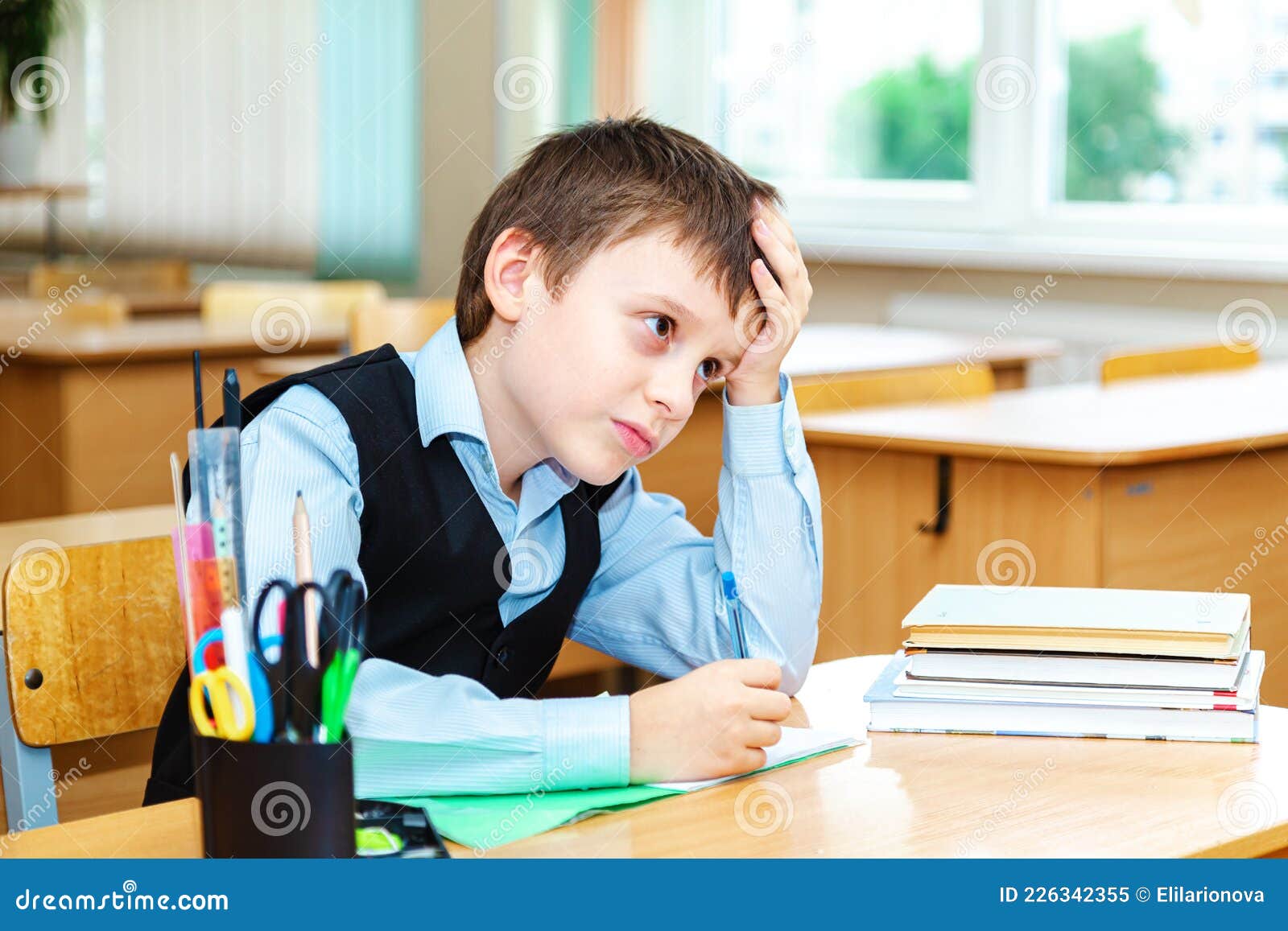 Serious Schoolboy in the Classroom. Stock Image - Image of learning ...