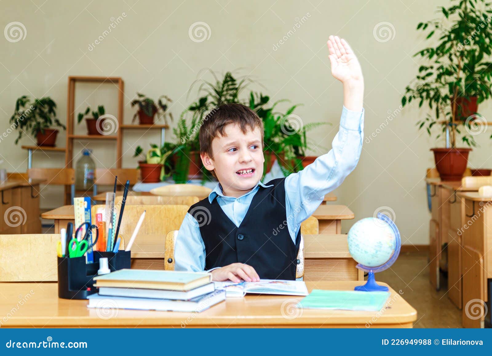 Serious Schoolboy in the Classroom Stock Photo - Image of distance ...
