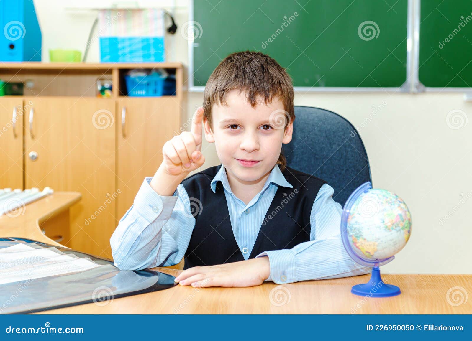 Serious Schoolboy in the Classroom Stock Photo - Image of education ...