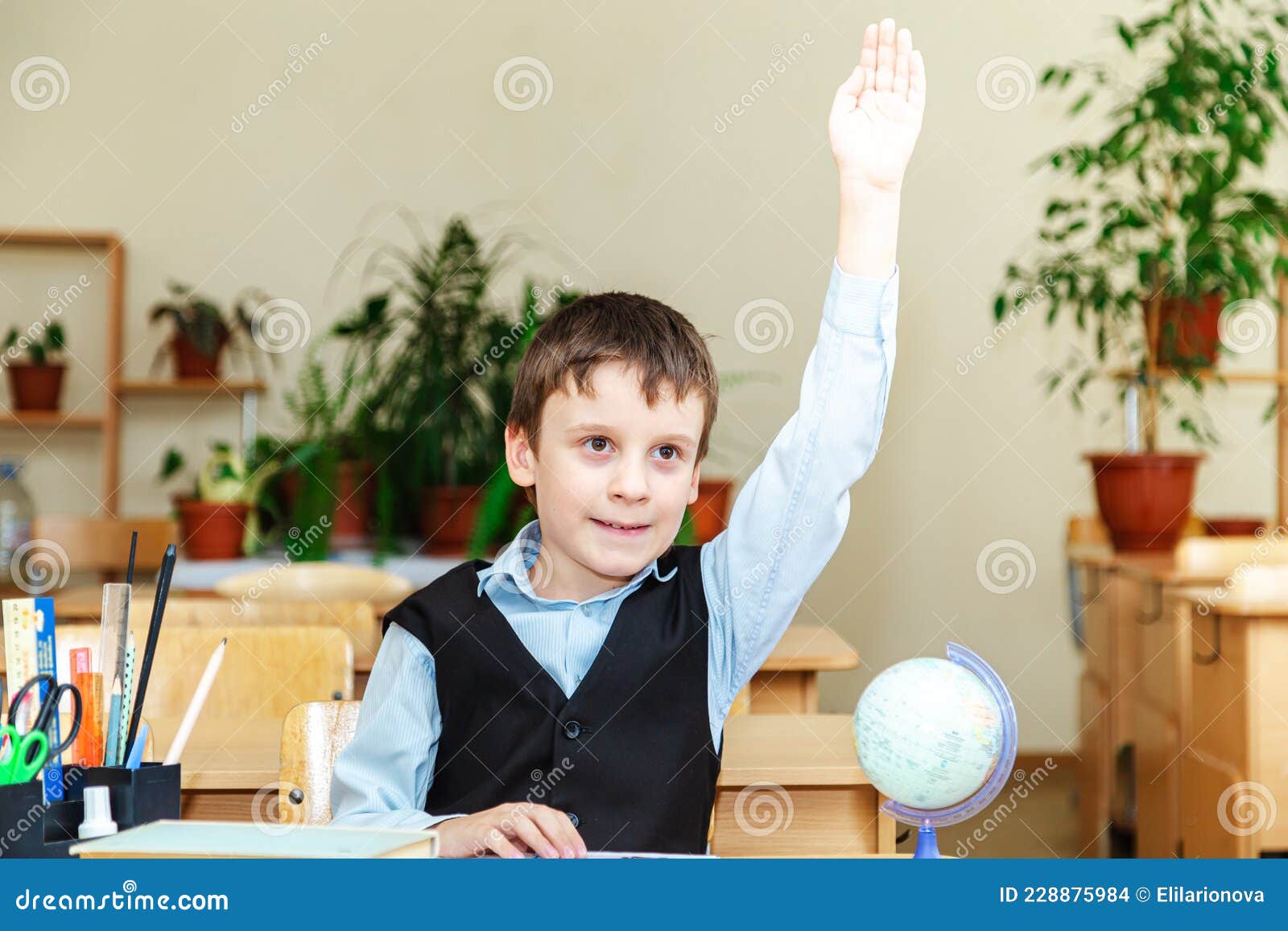 Serious Schoolboy in the Classroom Stock Photo - Image of knowledge ...