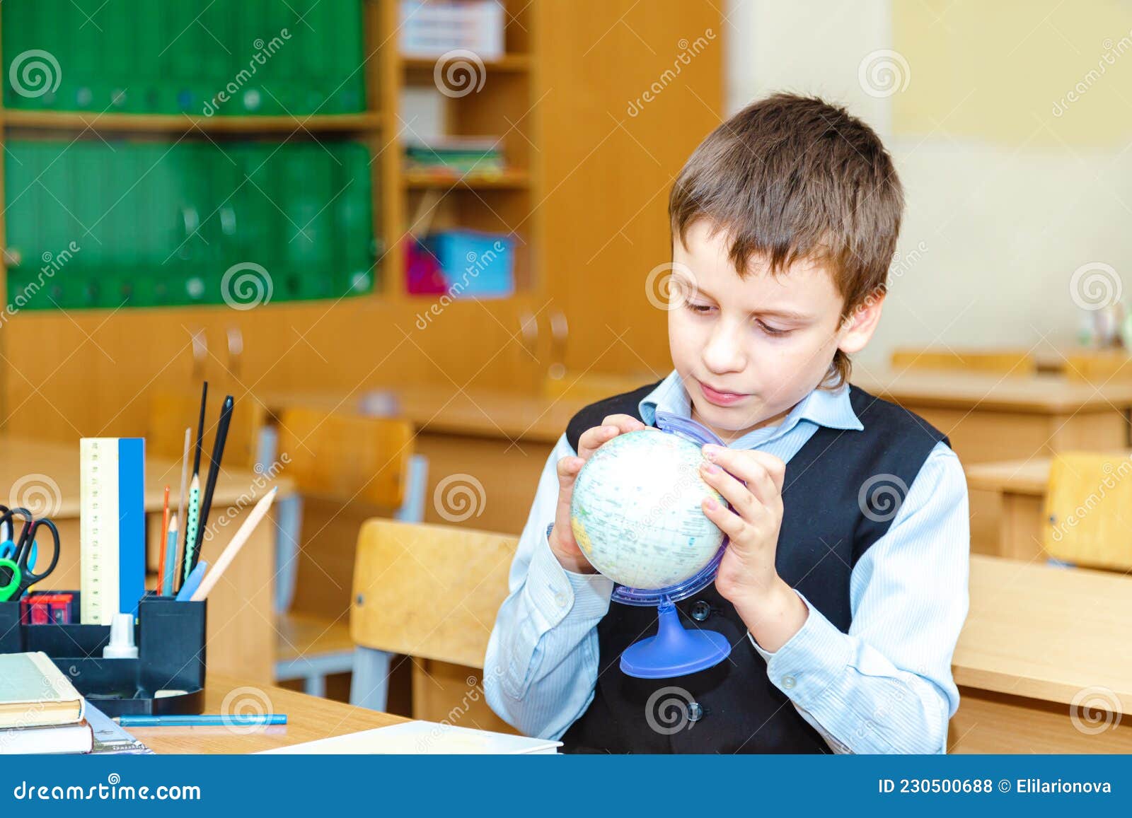 Serious Schoolboy in the Classroom Stock Photo - Image of learn ...
