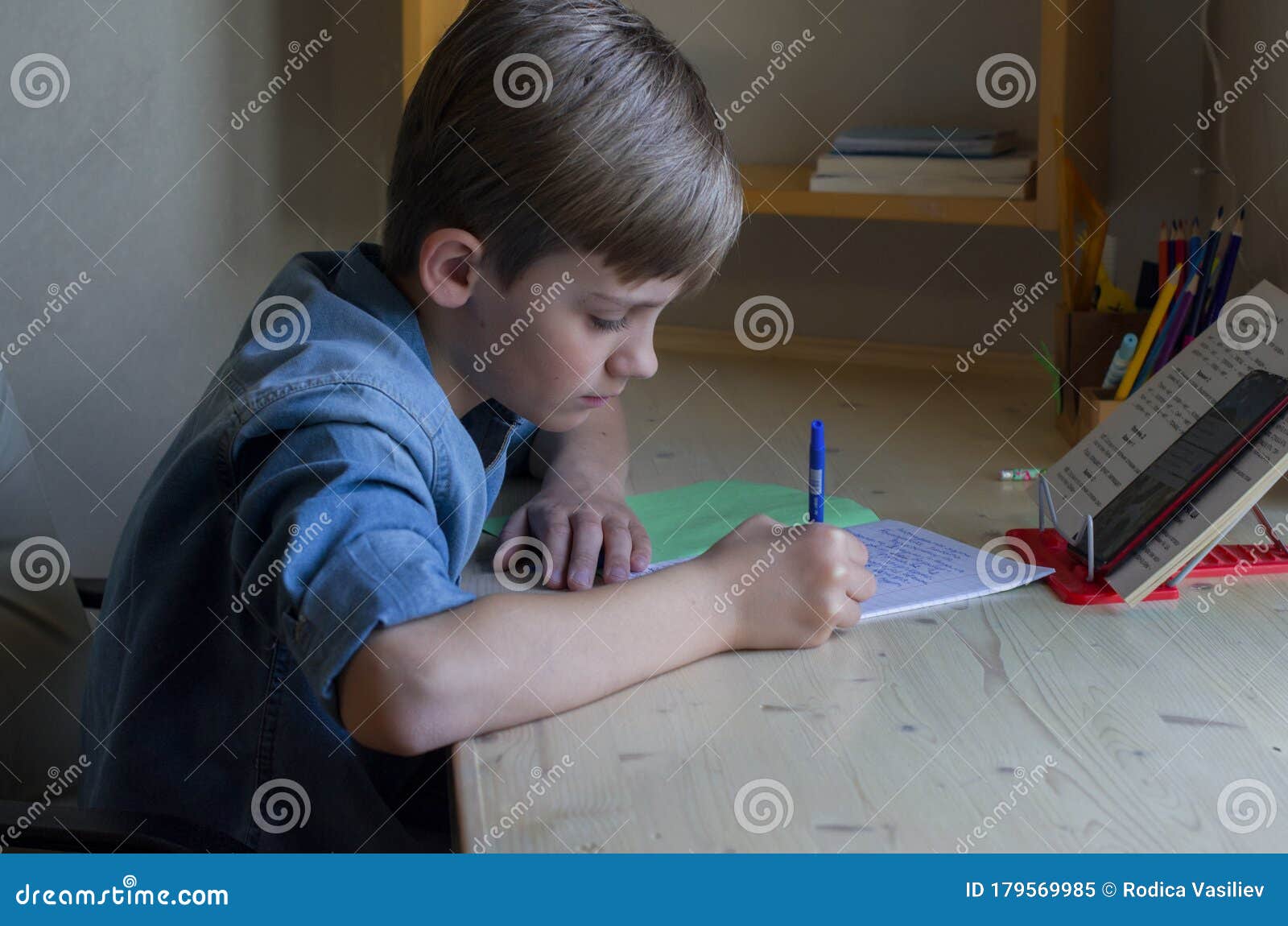 Serious Schoolboy Studying at Home during Quarantine. Stock Image ...