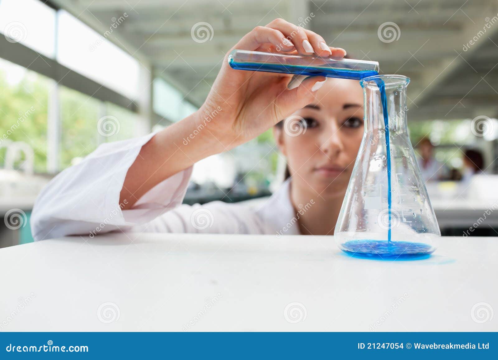 Serious Science Student Pouring Liquid Stock Photo - Image of ...