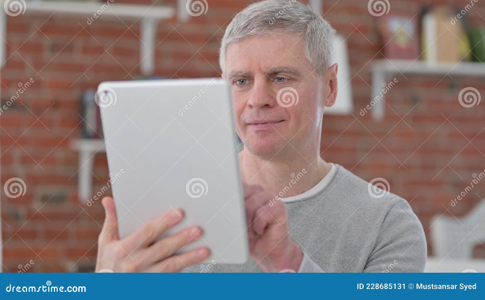 Serious Old Man Using Tablet Stock Image - Image of finger, touching ...