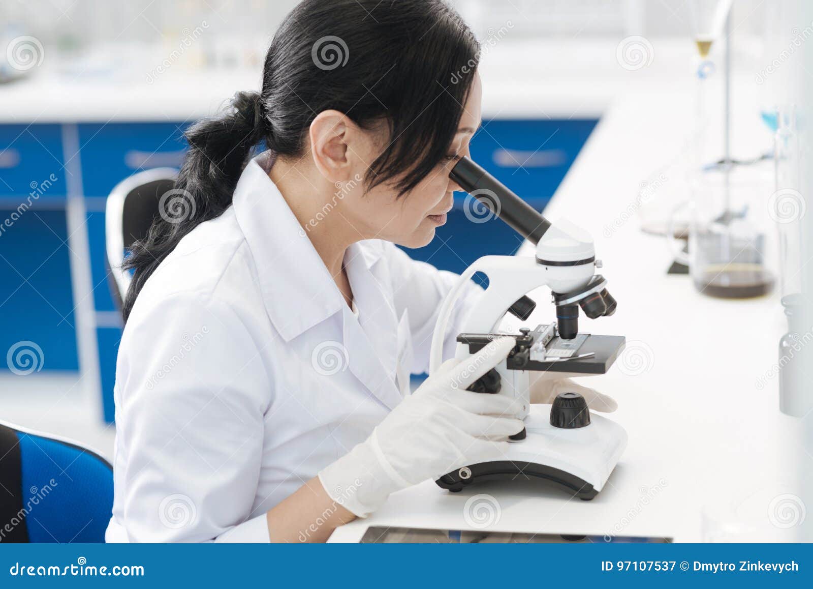 Serious Smart Woman Looking into the Microscope Stock Image - Image of ...