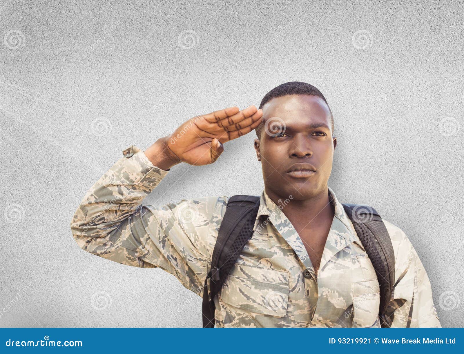 Serious Soldier Saluting. Concrete Wall Stock Image - Image of glow ...