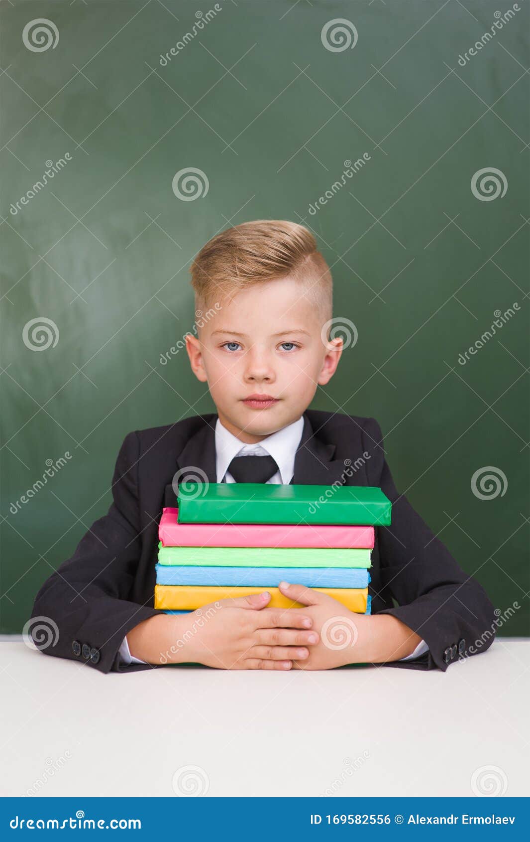 Serious Student Hugging a Stack of Books Stock Photo - Image of child ...