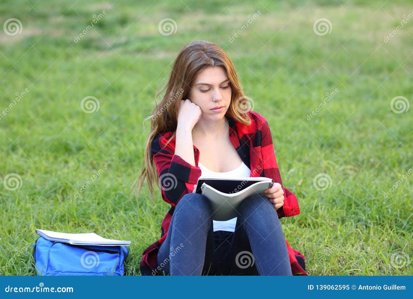 Serious Student Studying Reading Notes on the Grass Stock Image - Image ...