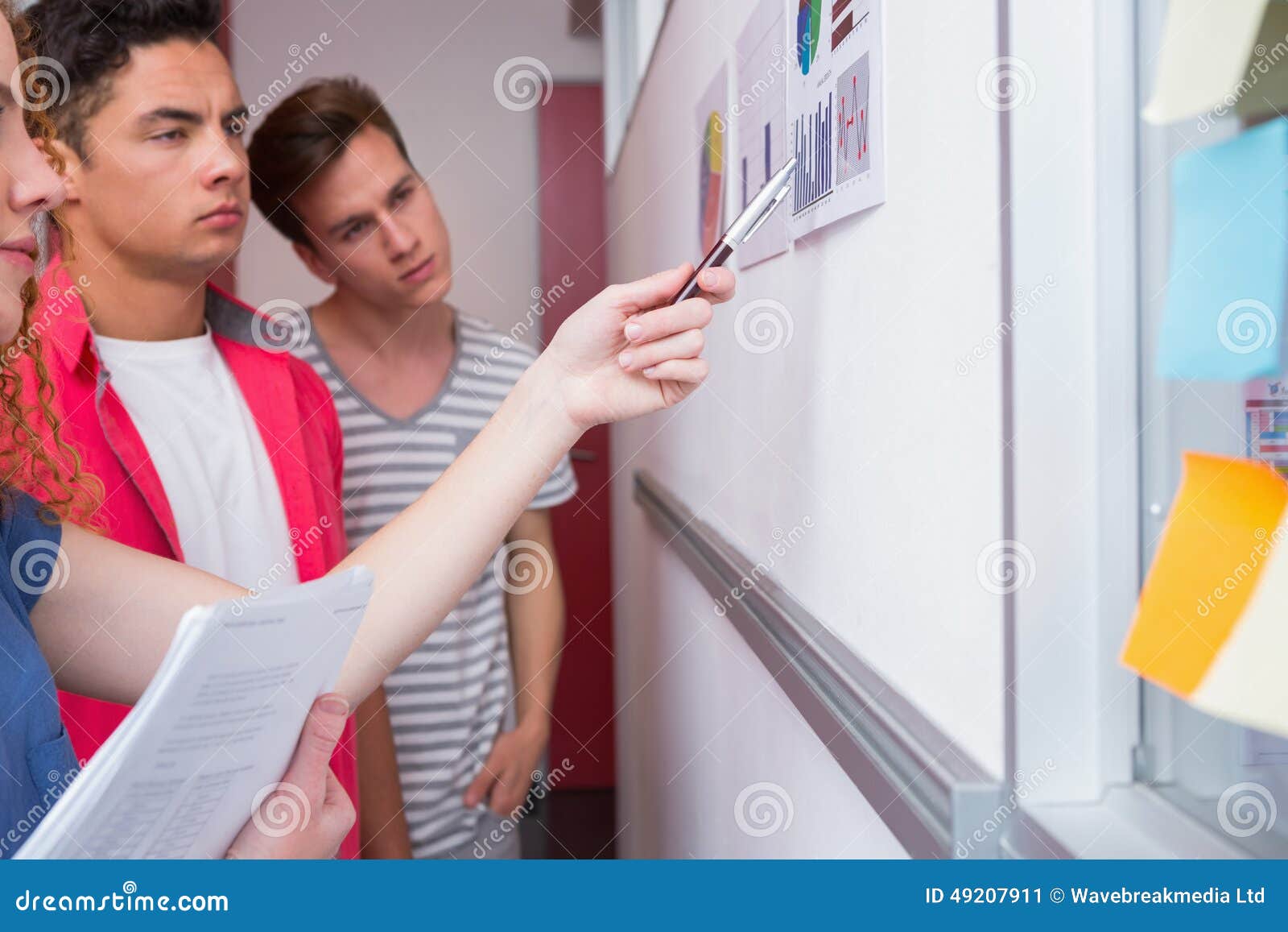 Serious Students Studying with Graphics on the Wall Stock Image - Image ...